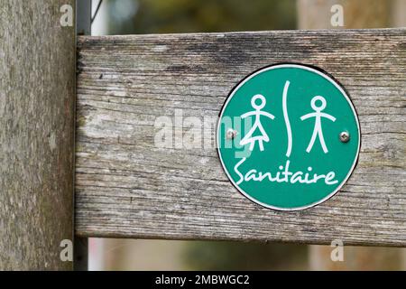 Toilettes french text means wc Toilet sign on wooden arrow water ...