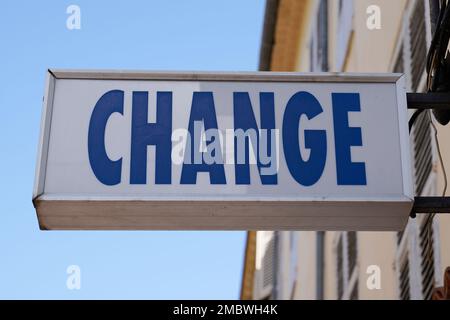 change means in french text exchange money office sign in wall building ...
