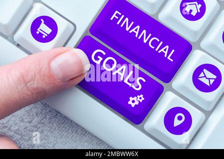 Hand writing sign Financial Goals. Word Written on targets usually ...