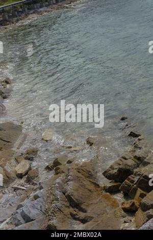 A beautiful shot of the sea waves gently hitting the rocks Stock Photo ...