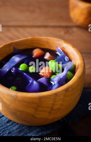 Red cabbage soup with peas and carrots Stock Photo - Alamy