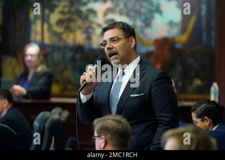 Florida State Rep. Alex Rizo, right, demonstrates the safe capture of a ...