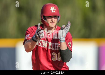 Boston College first baseman Joe Vetrano (30) gloves a thrown ball for ...