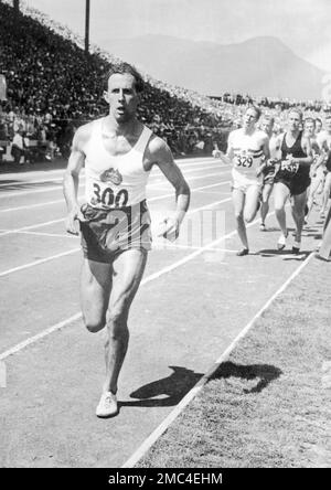 Roger Bannister leads John Landy of Australia across the finish line at ...