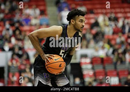 Washington guard Jamal Bey controls the ball during the first half of ...