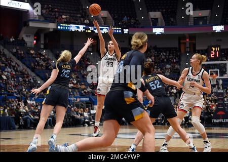 Connecticut's Caroline Ducharme (33) shoots as Xavier's Ayanna Townsend ...