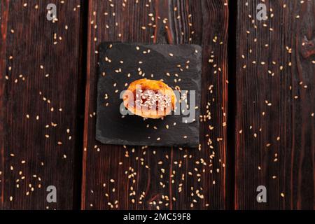 Baked shrimp gunkan on wooden background. Simple gunkan sushi with ...