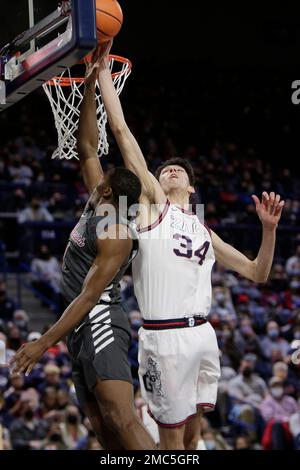 Gonzaga center Chet Holmgren, right, controls the ball while defended ...
