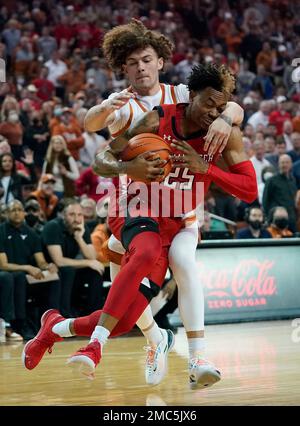 Texas guard Devin Askew (5) drives around Houston Baptist guard Jade ...