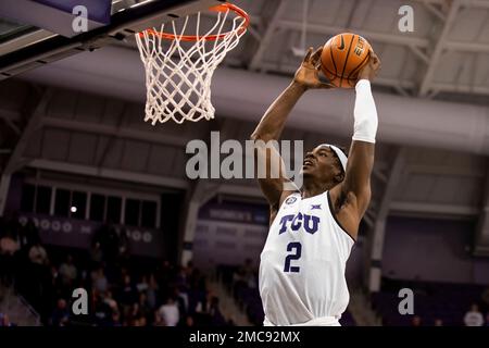 TCU forward Emanuel Miller (2) leaps in the air for a slam dunk as ...