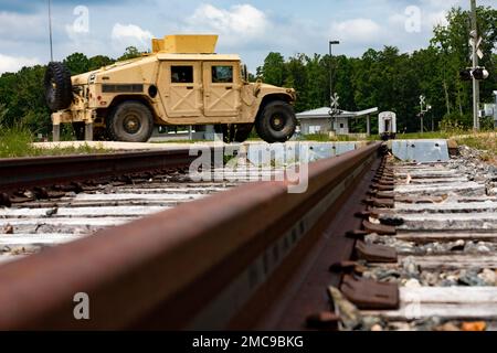 A U.S. Army High-Mobility Multipurpose Wheeled Vehicle (HMMWV) is ...