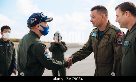 U.S. Marine Corps Maj. Scott Caton accepts a plaque on behalf of Capt ...