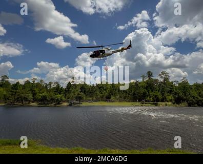 A 413th Flight Test Squadron UH-1 Huey lifts two 20th Air Support ...