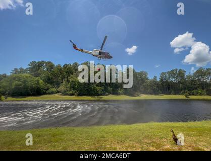 A 413th Flight Test Squadron UH-1 Huey lifts two 20th Air Support ...