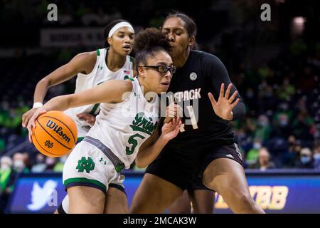 Notre Dame's Olivia Miles (5) drives past Connecticut's Caroline ...