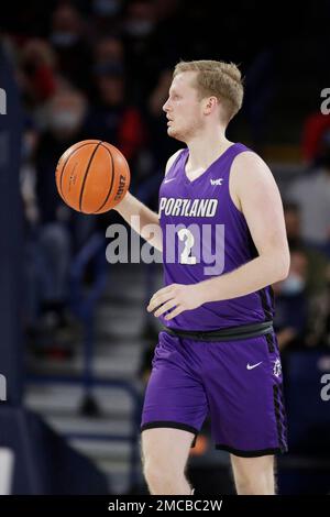 Portland guard Tyler Robertson controls the ball during the first half ...