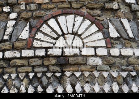 details of the mosaic work on a tower of the historical roman city wall ...