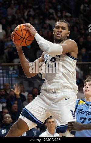 Villanova forward Eric Dixon (43) grabs a rebound between UCLA guard ...