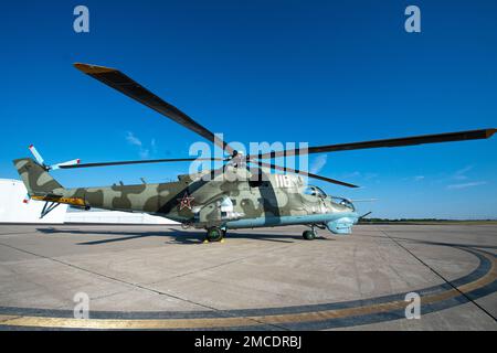 A HH-60W combat rescue helicopter follows behind its wingman in support ...