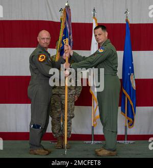Col. Mathew Gaetke, 51st Operations Group commander, left, receives the ...