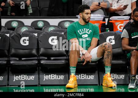 Boston Celtics' Jayson Tatum (0) sits on the floor after his shot ...