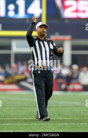 Referee Adrian Hill signals during an NFL football game between the ...