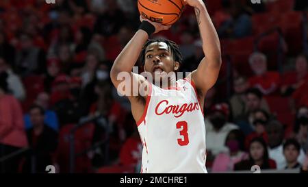 Houston guard Ramon Walker Jr. (3) dibbles past Cincinnati's Mika Adams ...