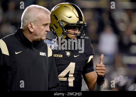 Army quarterback Christian Anderson, right, cuts up field past ...