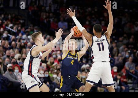 Gonzaga forward Ben Gregg, left, and Pacific forward Sammy Freeman go ...
