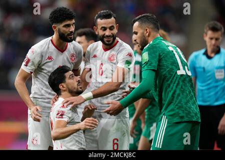 Tunisia's Mohamed Ben Hmida, left, argues with Algeria's Abdelkader ...