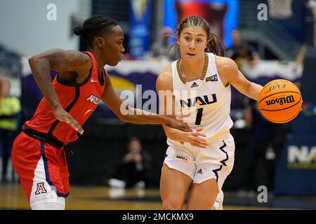 Northern Arizona guard Regan Schenck (1) drives against Arizona guard ...