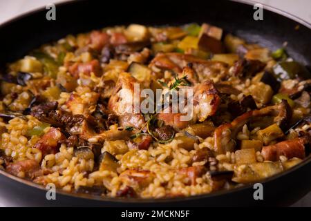 Original spanish paella recipe with rabbit, pork and vegetables Stock ...