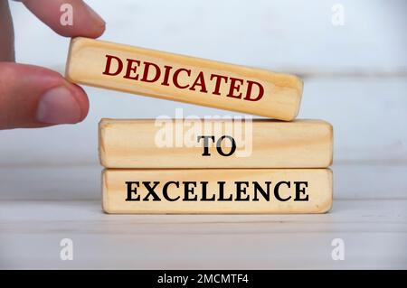 Dedicated To Excellence Concept text on background Stock Photo - Alamy