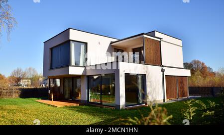 Cubist architecture. Cozy and modern house with garage and cobblestone ...