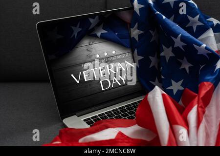 veterans day written in laptop with flag of the United States, on a ...