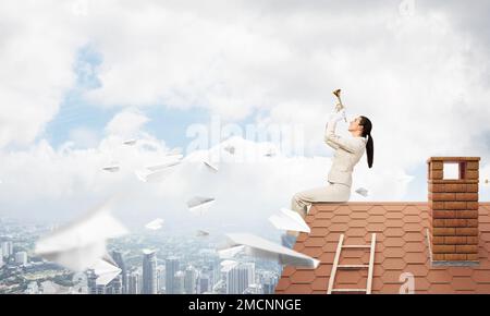 Attractive woman playing trumpet brass Stock Photo - Alamy