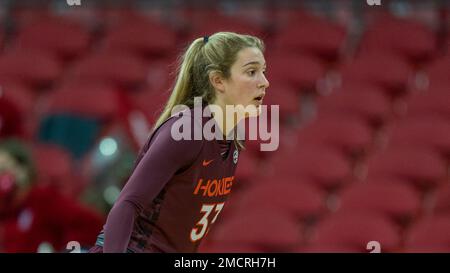 Virginia Tech's Elizabeth Kitley (33) center, huddles with her ...
