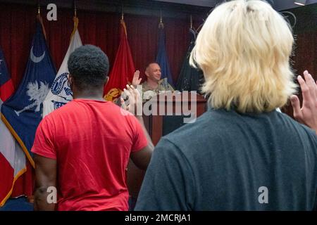 Col. Ryan Hanson, Fort Jackson garrison commander, left, and his son ...
