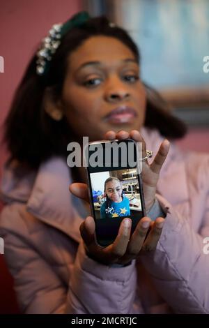 Brittany Tichenor-Cox, holds a photo of her daughter, Isabella "Izzy ...