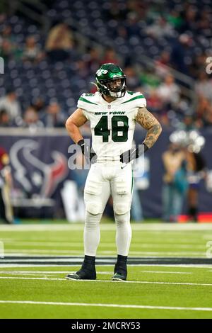 New York Jets fullback Nick Bawden (48) holds the ball on the field ...