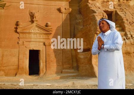 Rawi, storyteller, in front of the Nabataean tombs at the rock Qasr Al ...
