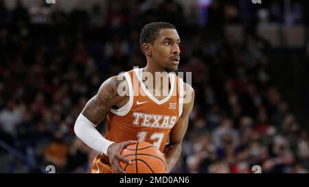 Texas guard Jase Febres controls the ball during the second half of an ...