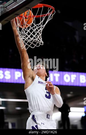 Northwestern guard Ty Berry drives to the basket against Iowa during ...