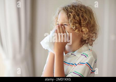 Ill little boy coughing in bedroom Stock Photo - Alamy