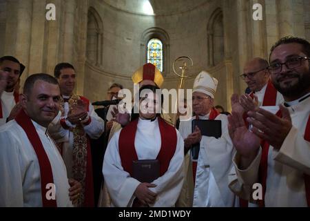 Sally Ibrahim Azar, center, a Palestinian Christian and Council member ...