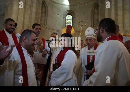 Sally Ibrahim Azar, center, a Palestinian Christian and Council member ...