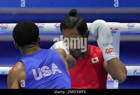 United States' Omari Jones, left, fights with Japan's Sewonrets Okazawa ...