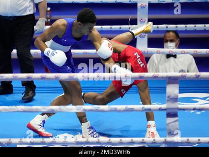 United States' Omari Jones, left, fights with Japan's Sewonrets Okazawa ...