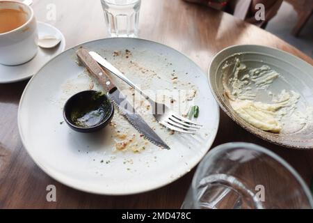 Empty plate after eating on table Stock Photo - Alamy