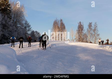 UMEÅ, SWEDEN ON JANUARY 21, 2023. Unidentified people enjoying weather ...